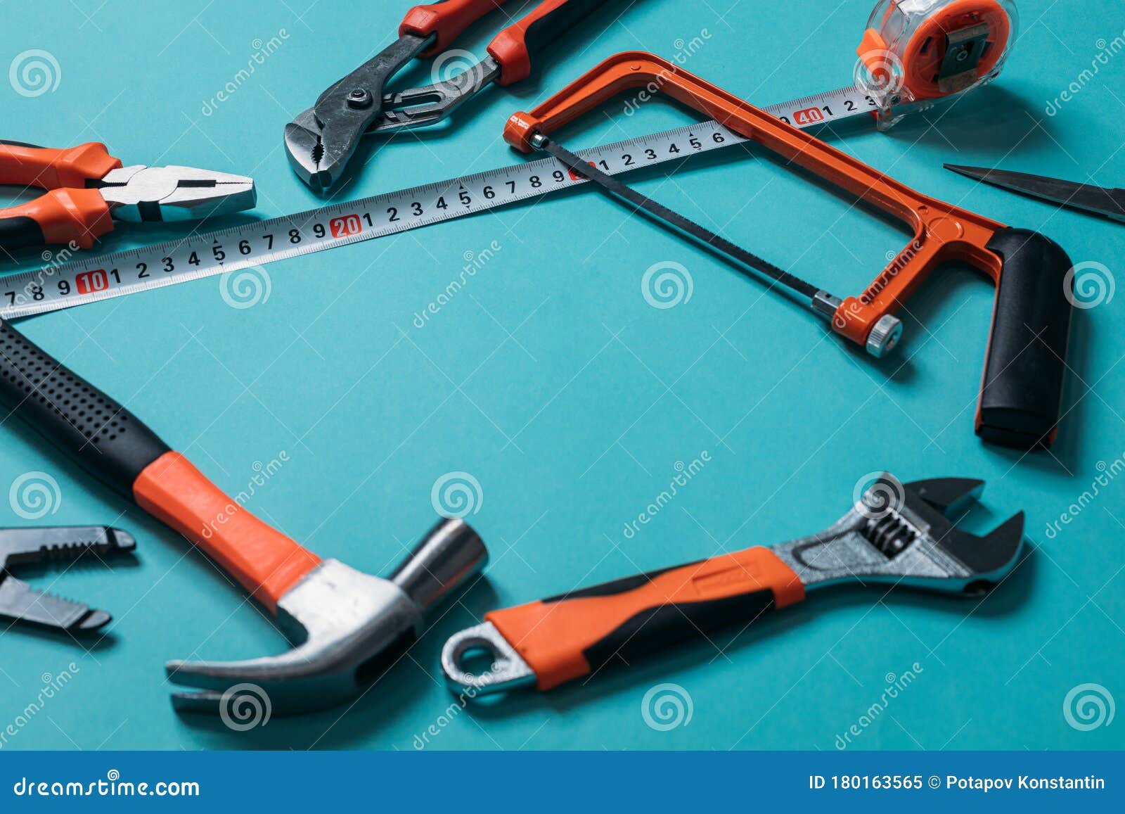 Group Bunch of Tools with Orange Handles on a Blue Background Close ...
