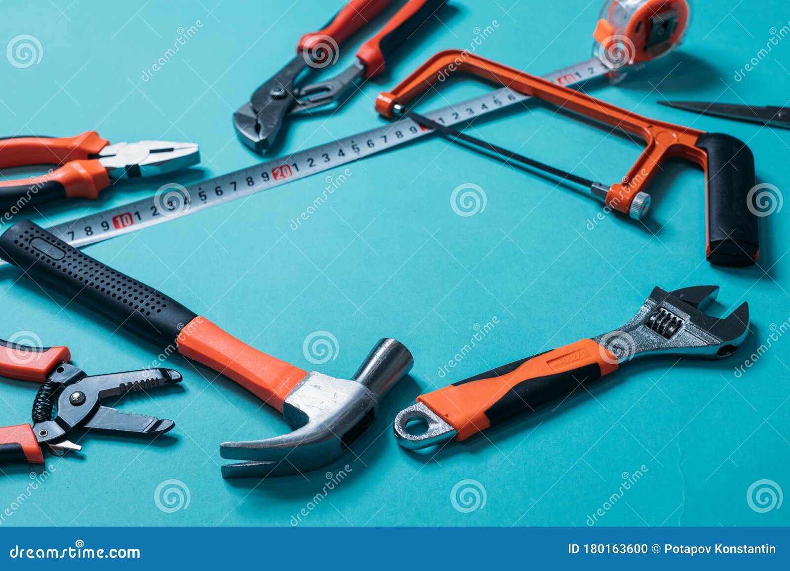 Group Bunch of Tools with Orange Handles on a Blue Background Close ...