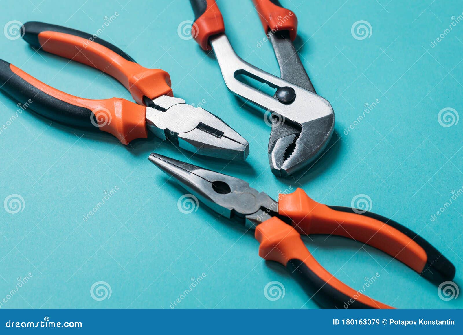 Group a Bunch of Tools with Orange Handles on a Blue Background Laid ...