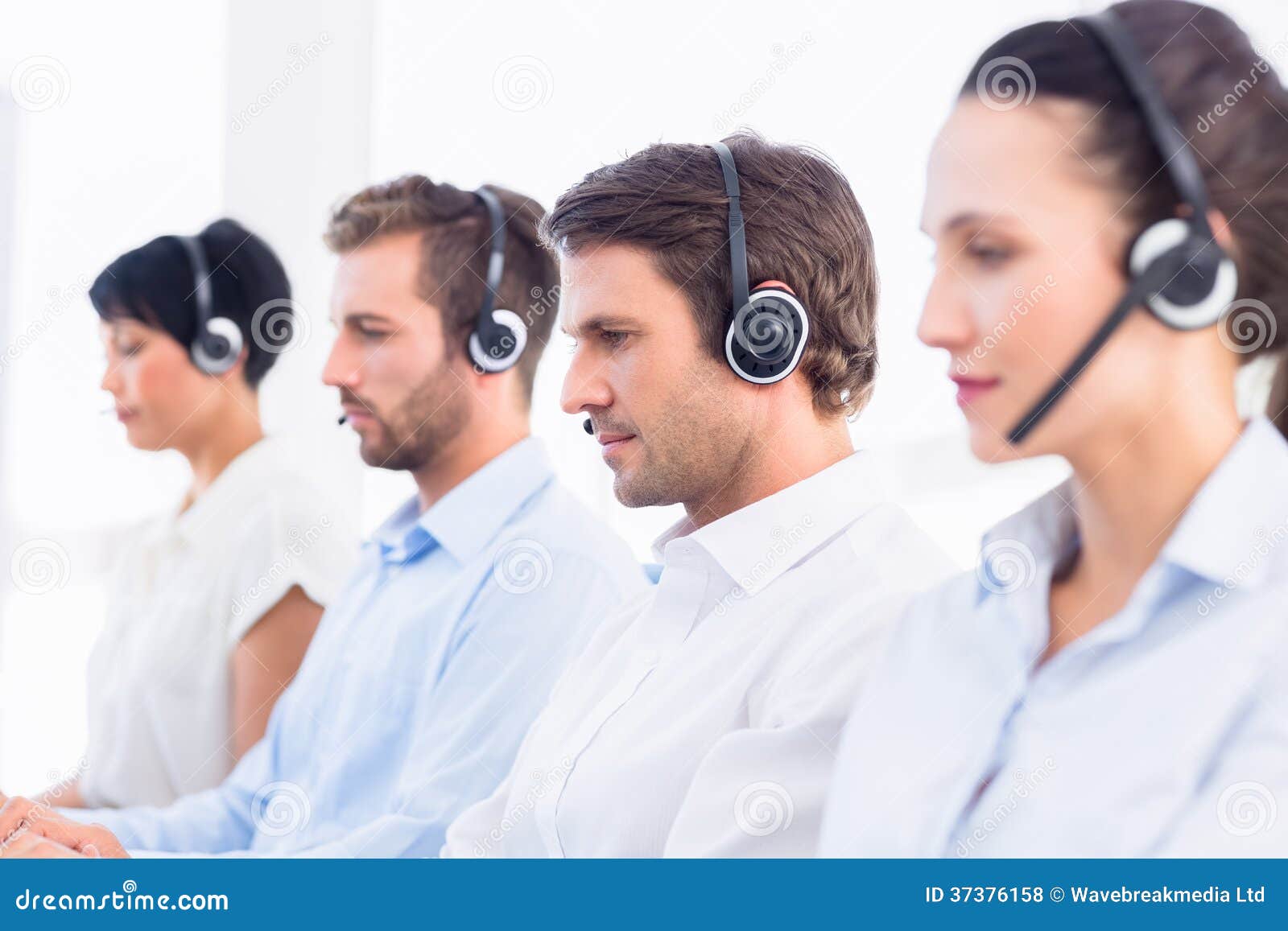 Group of Business Colleagues with Headsets in a Row Stock Photo - Image ...