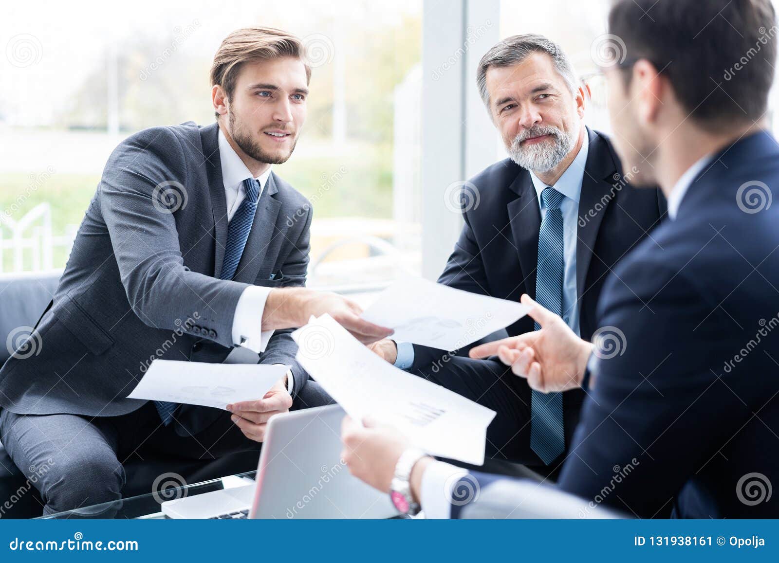 Group of Business Partners Discussing Ideas and Planning Work in Office ...