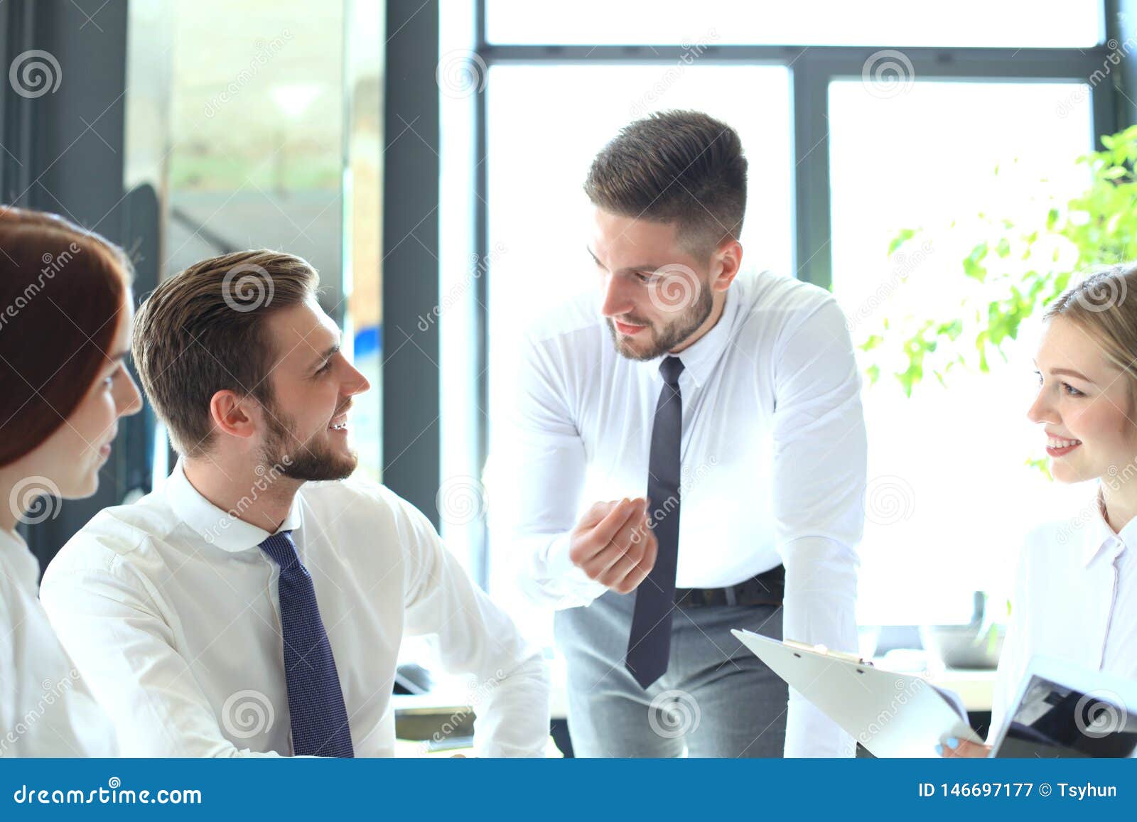 Group of Business Partners Discussing Ideas and Planning Work in Office ...