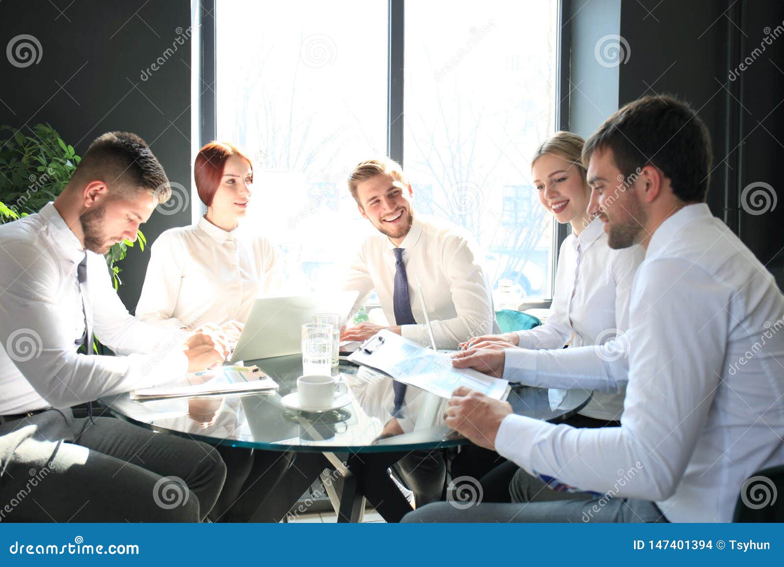 Group of Business Partners Discussing Ideas and Planning Work in Office ...