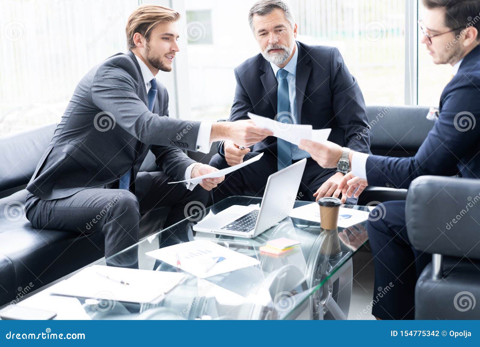 Group of Business Partners Discussing Ideas and Planning Work in Office ...