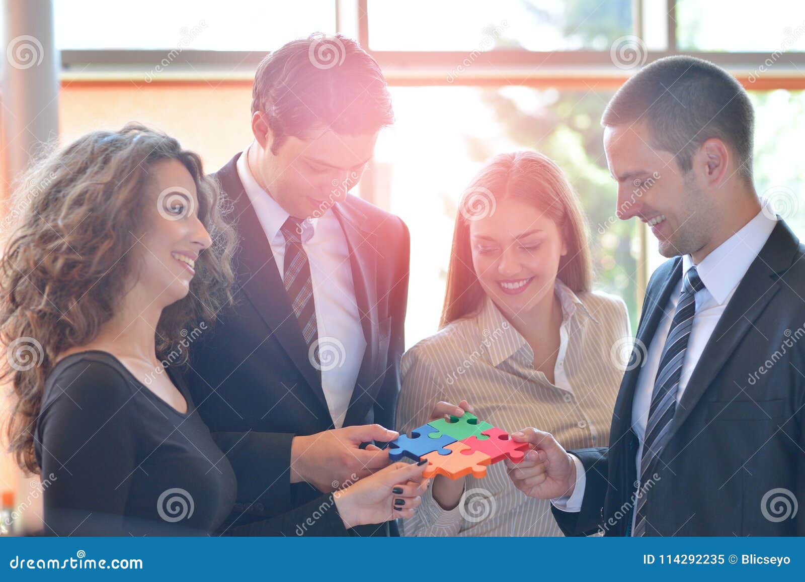 Group of Business People Assembling Jigsaw Puzzle and Represent Stock ...