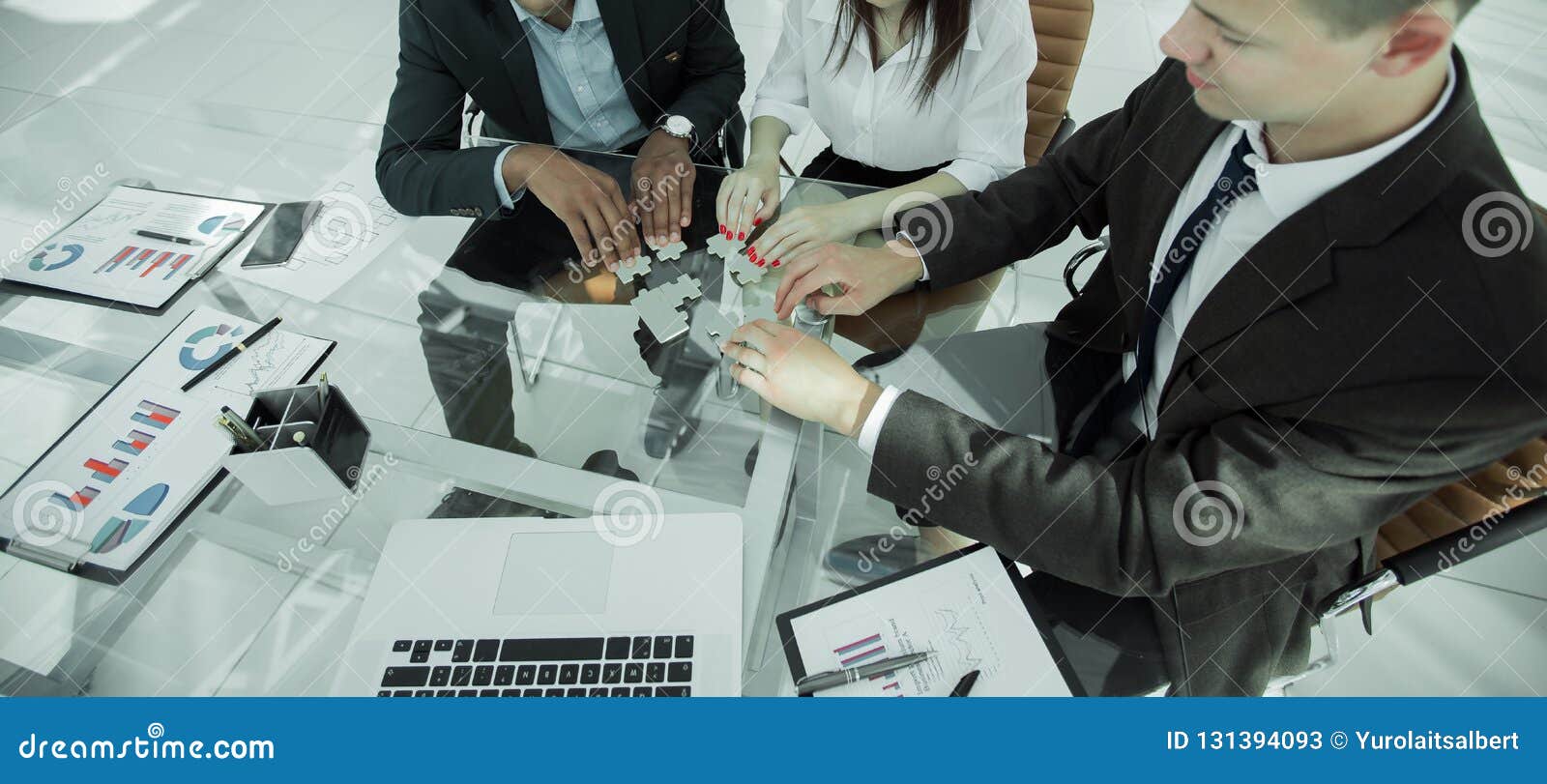 Group of Business People Assembling the Pieces of the Puzzle Stock ...