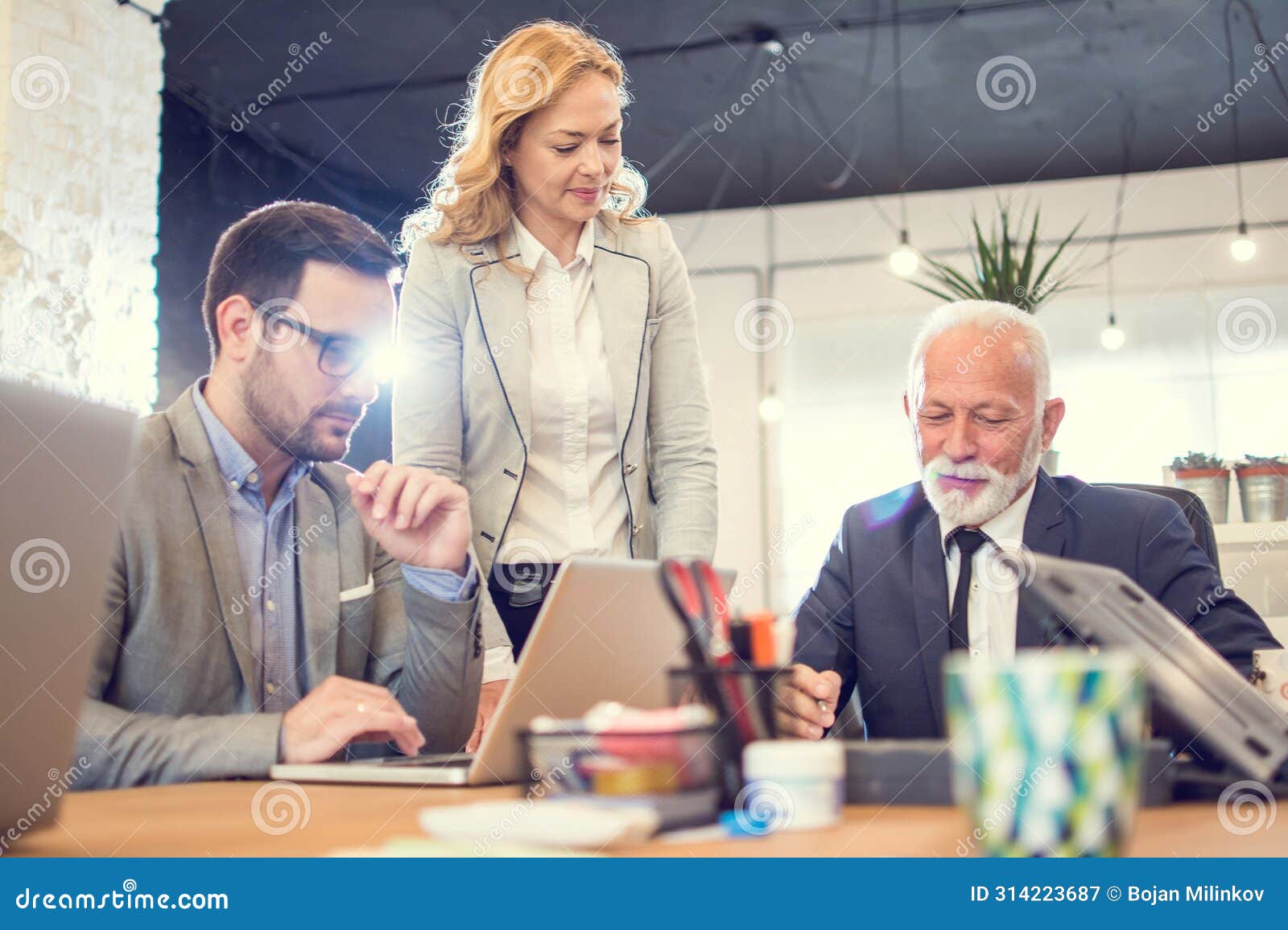 Group of Business People Collaborating on Project in Office Stock Image ...