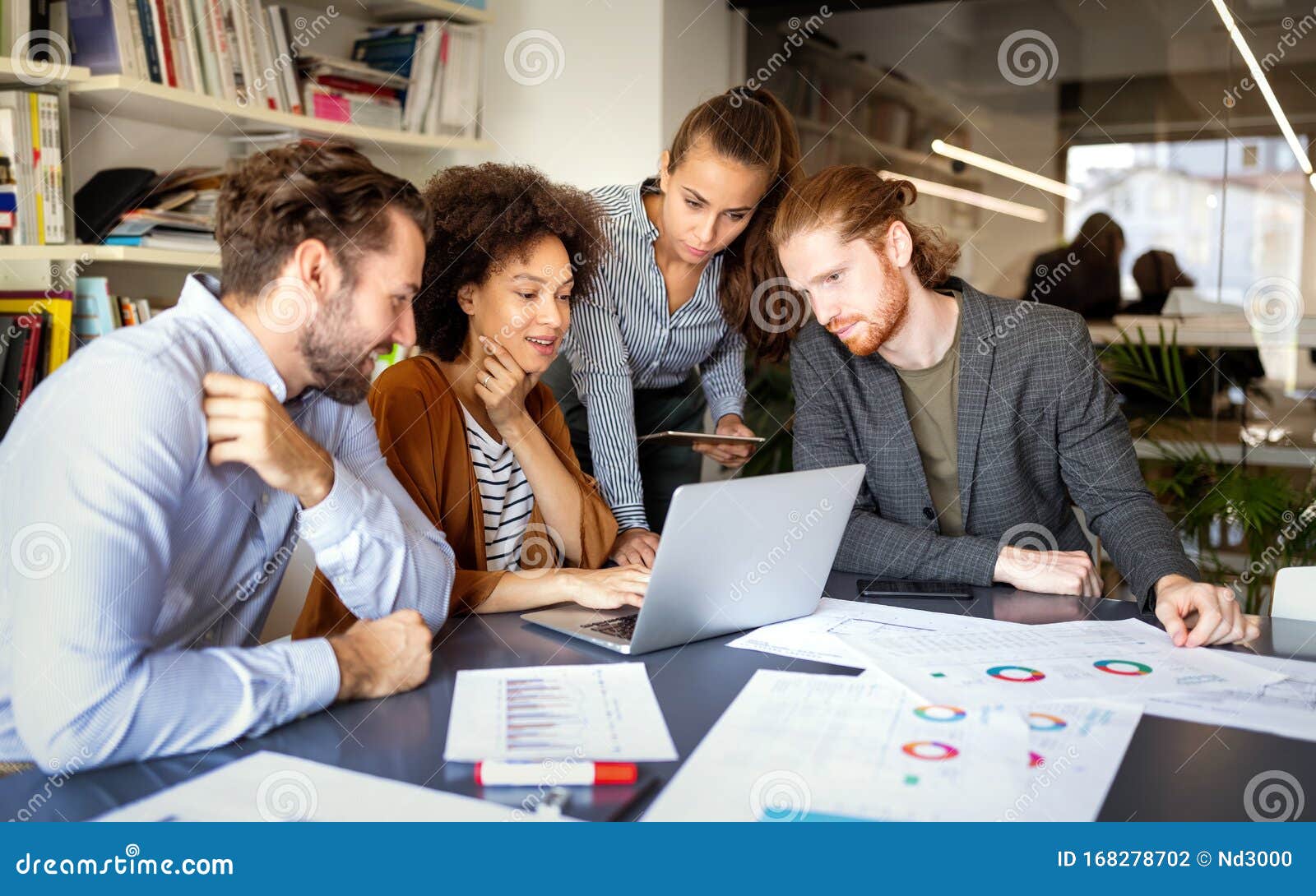 Group of Business People Collaborating on Project in Office Stock Photo ...