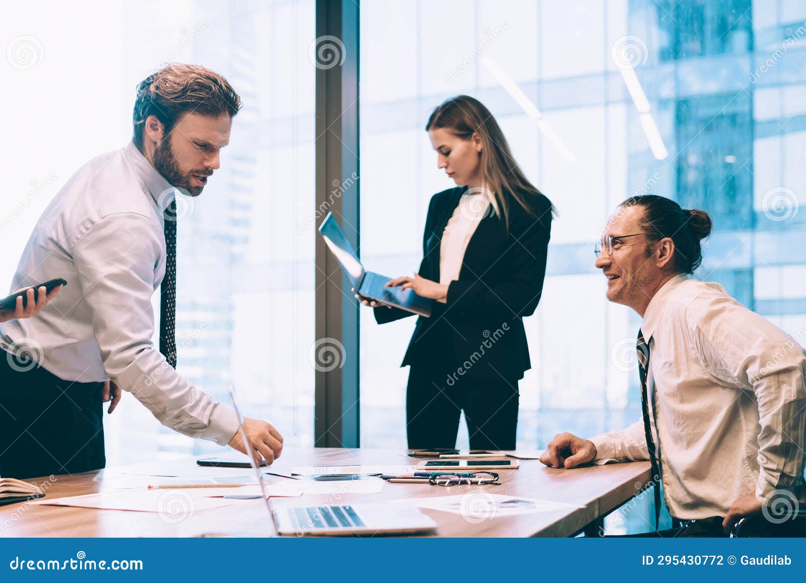 Group of Business People Communicating and Working at Table Stock Photo ...
