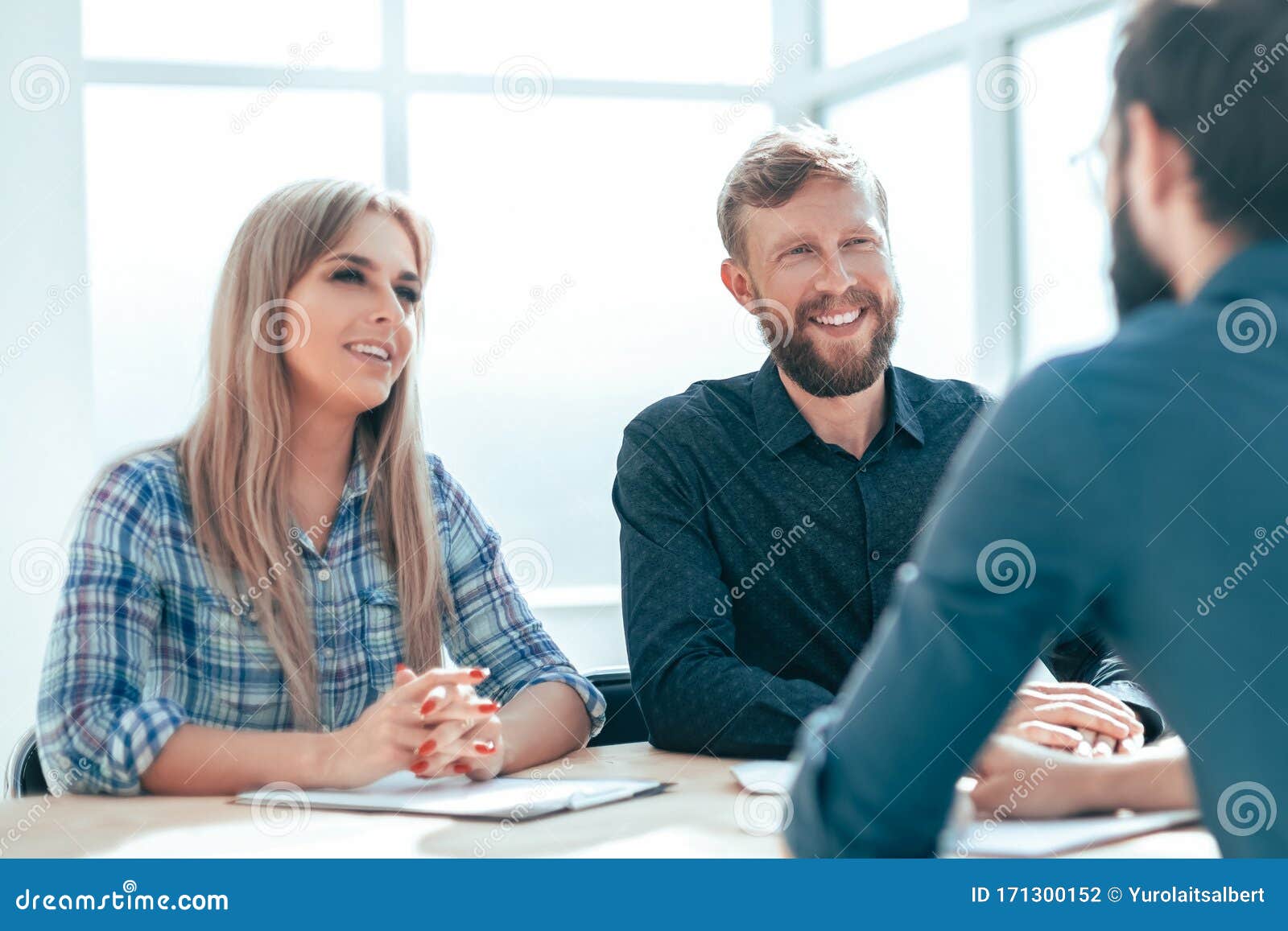 Group of Business People Conducting an Interview Sitting at the Table ...
