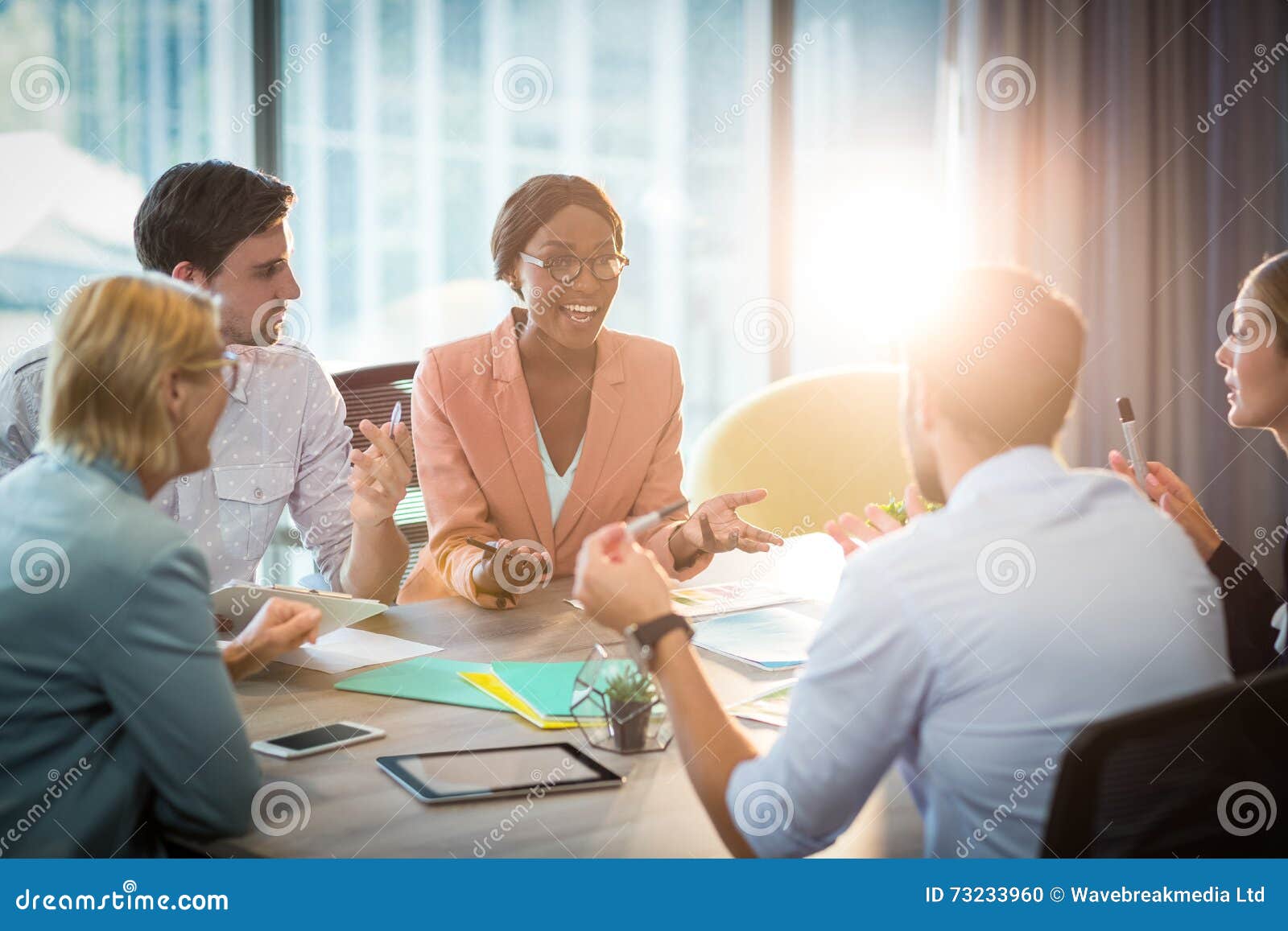 Group of Business People Discussing at Desk Stock Photo - Image of ...