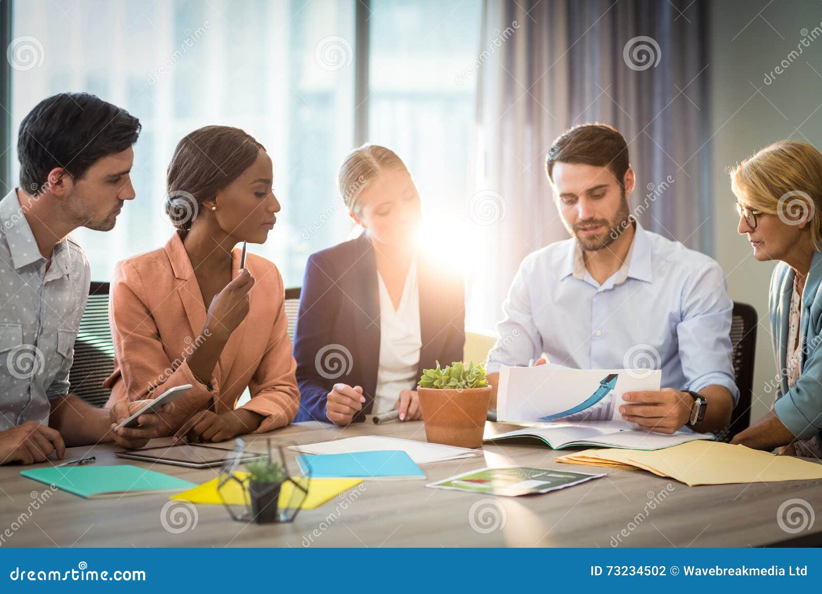 Group of Business People Discussing at Desk Stock Photo - Image of ...