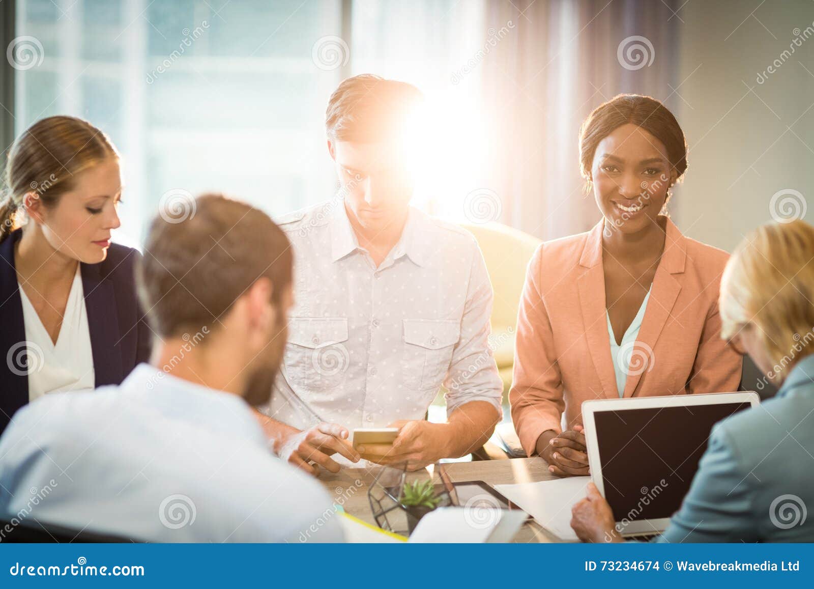 Group of Business People Discussing at Desk Stock Photo - Image of ...