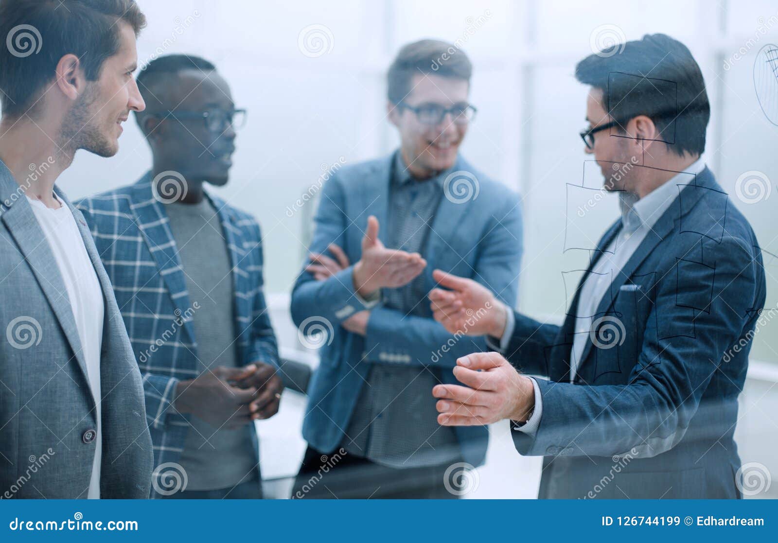 Group of Business People Discussing Something Standing in the Office ... Group of Business People Discussing Something Standing in the Office ...
