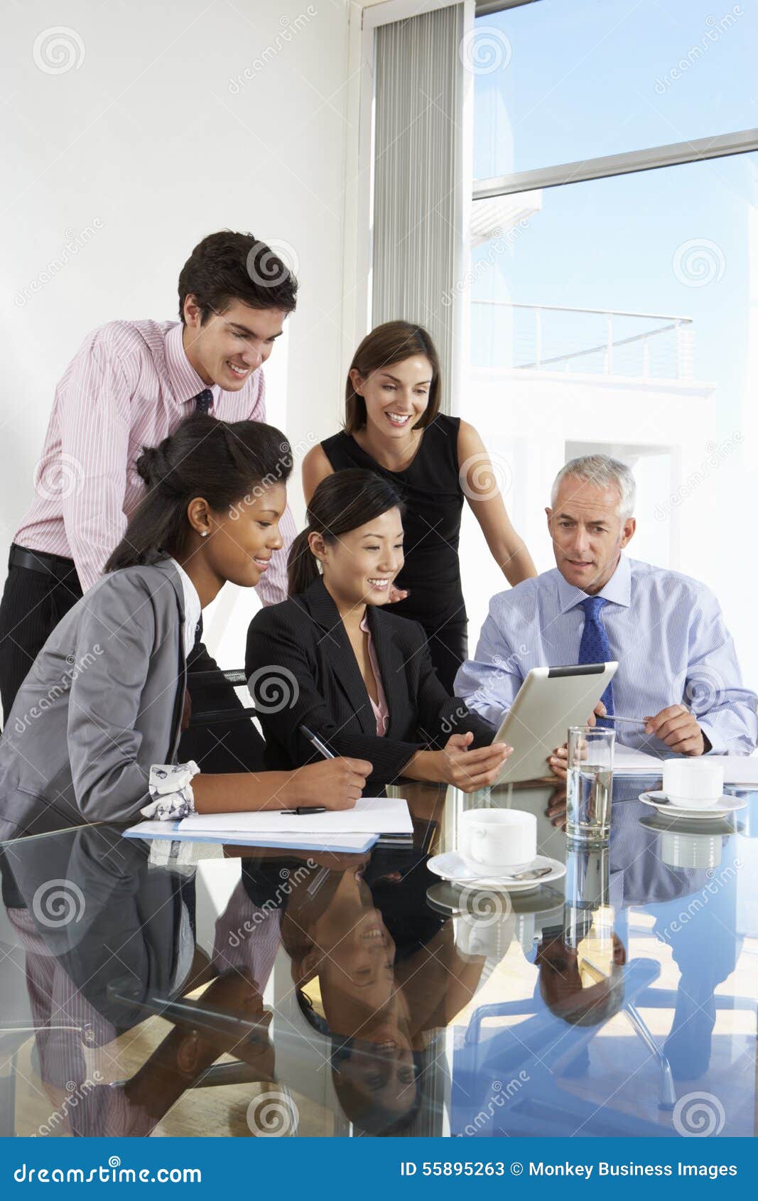 Group of Business People Having Meeting Around Tablet Computer a Stock ...