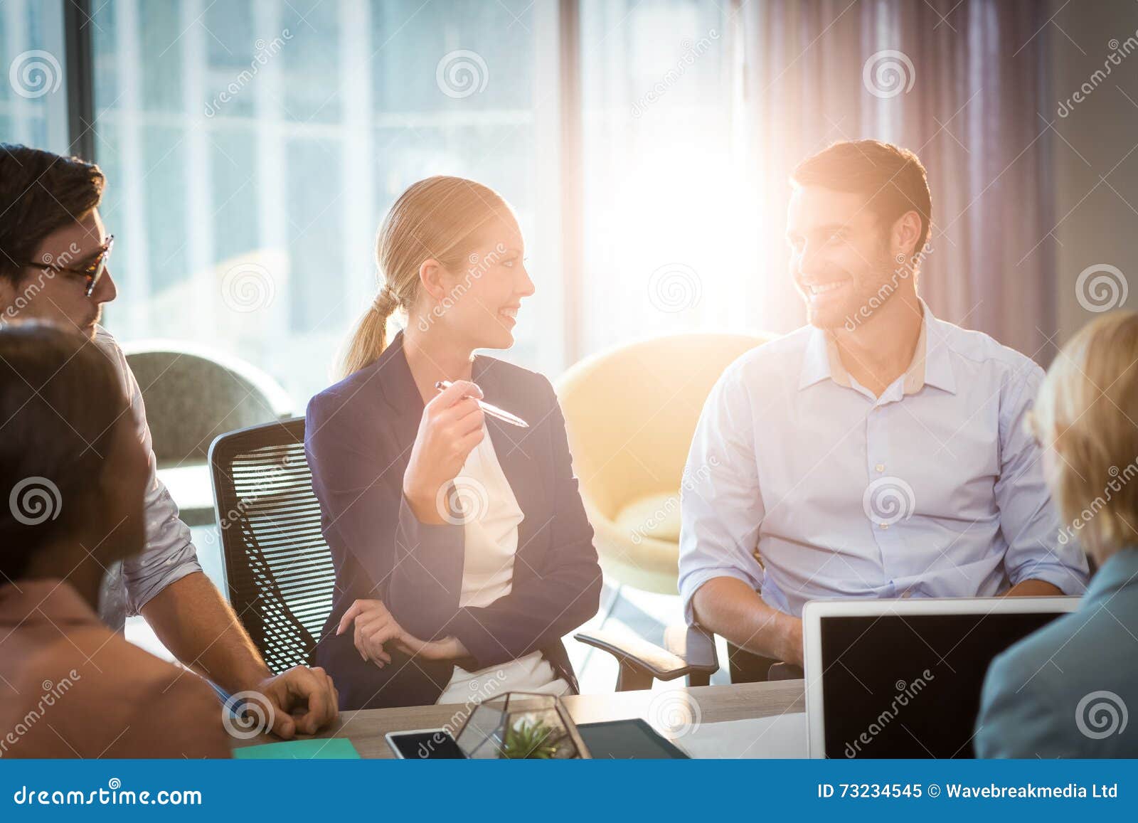 Group of Business People Interacting at Desk Stock Image - Image of ...