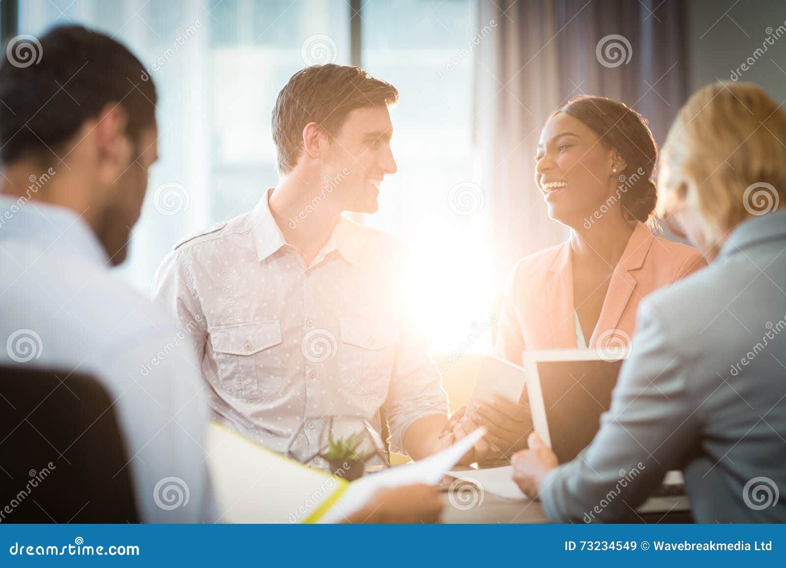 Group of Business People Interacting at Desk Stock Image - Image of ...