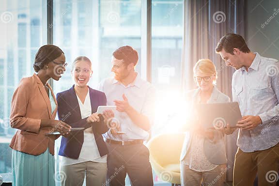 Group of Business People Interacting Using Mobile Phone, Digital Tablet ... Group of Business People Interacting Using Mobile Phone, Digital Tablet ...