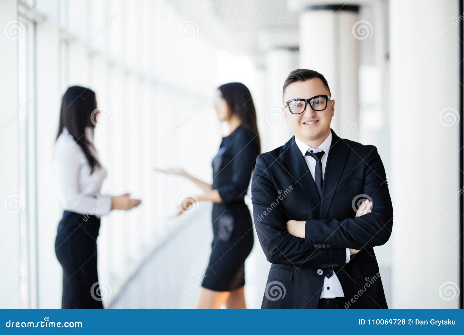 Group of Business People with Leader at Front in Office Stock Photo ...