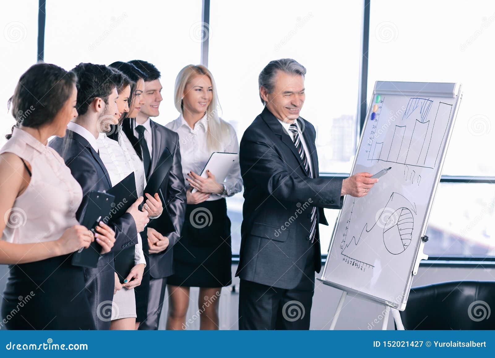 Group of Business People Looking at the Graph on Flipchart Stock Image ...