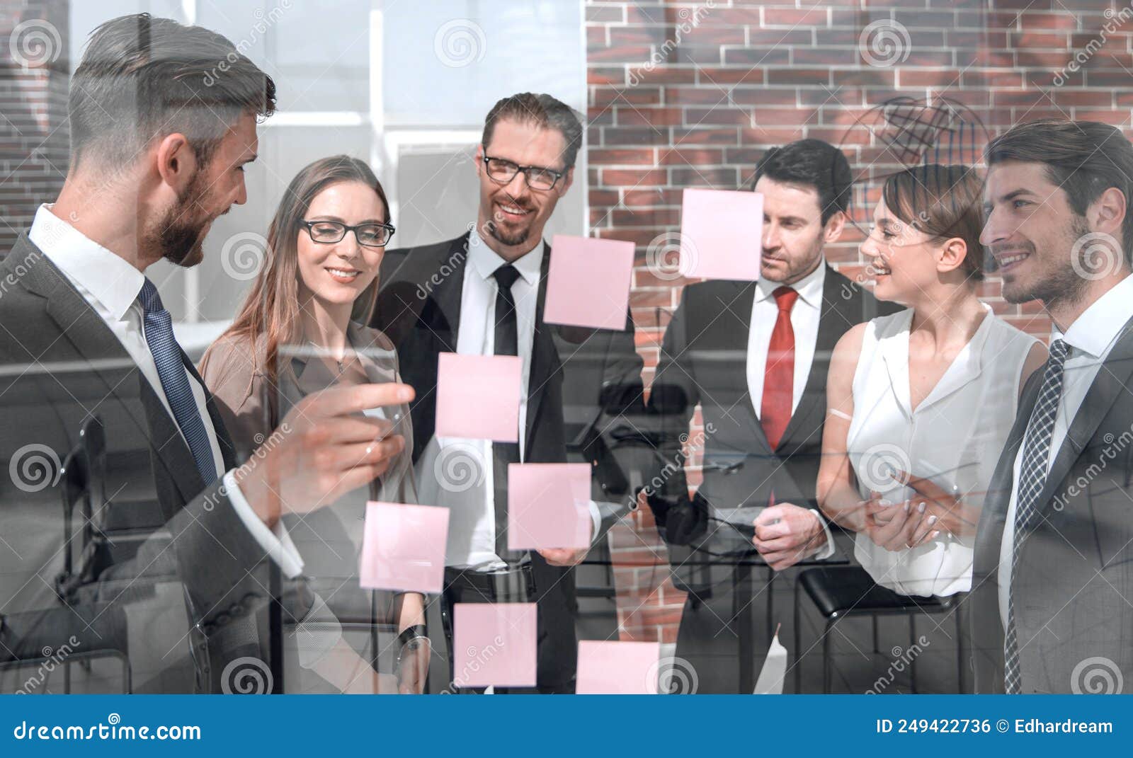 Group of Business People Looking at Notes on Glass Stock Photo - Image ...