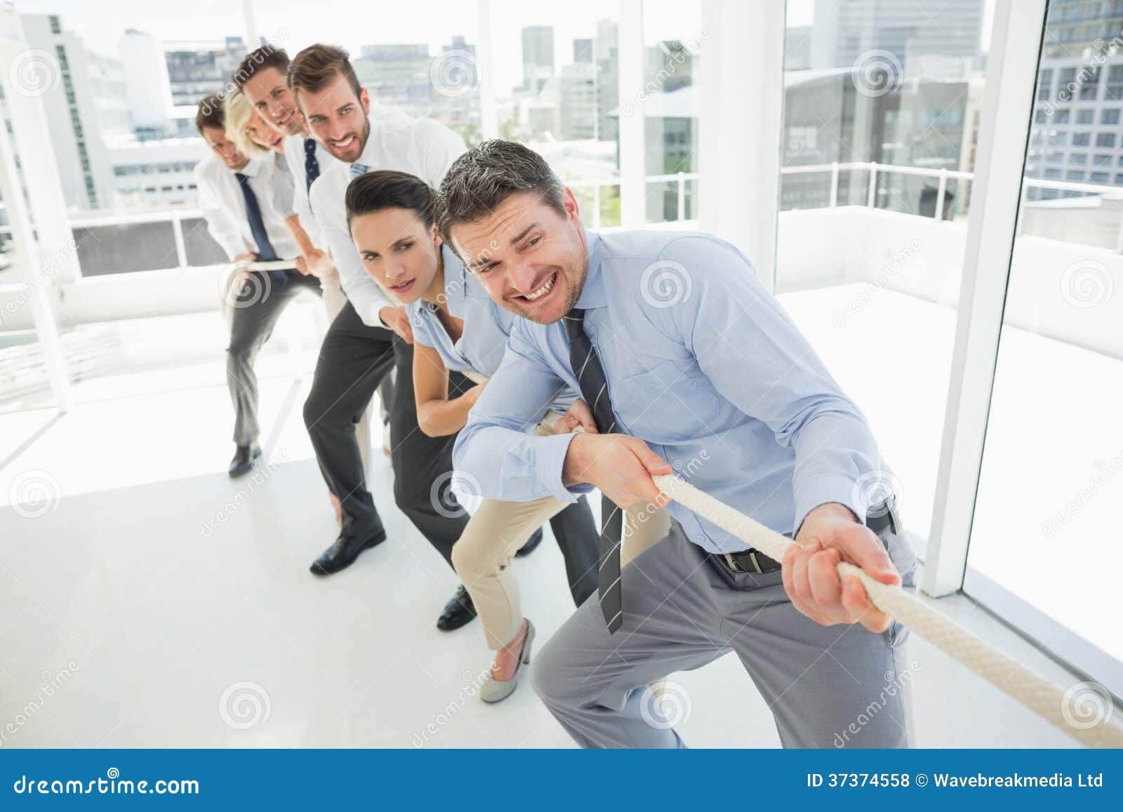 Group of Business People Pulling Rope in Office Stock Photo - Image of ...