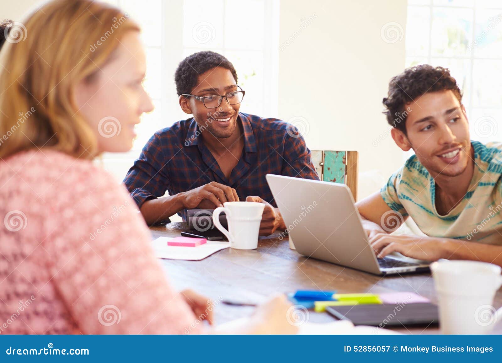 Group Of Business People Sitting Around Table In Meeting Stock Photo ...
