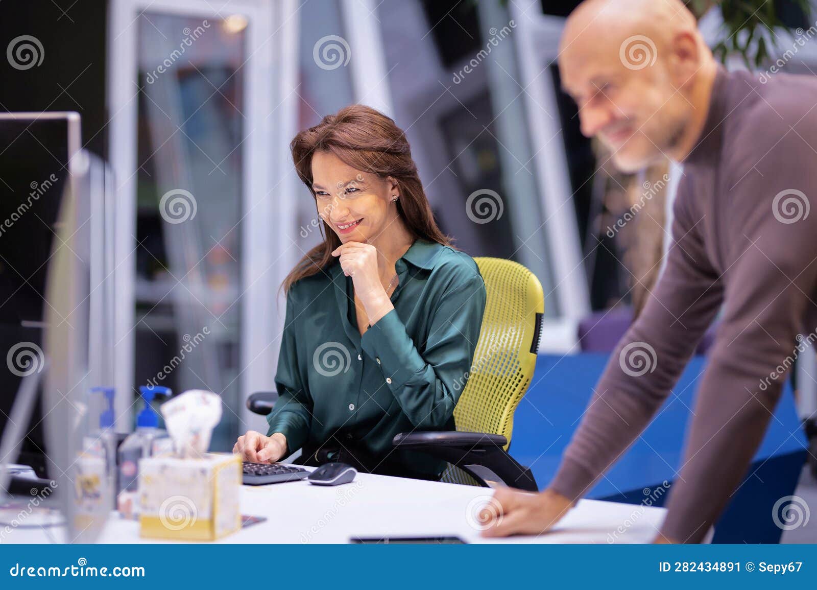 Group of Business People Sitting and Standing at Office Desk Surrounded ...