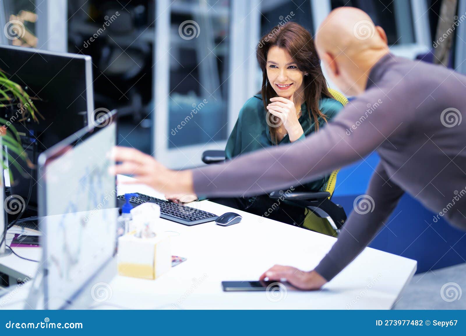 Group of Business People Sitting and Standing Together at the Office ...