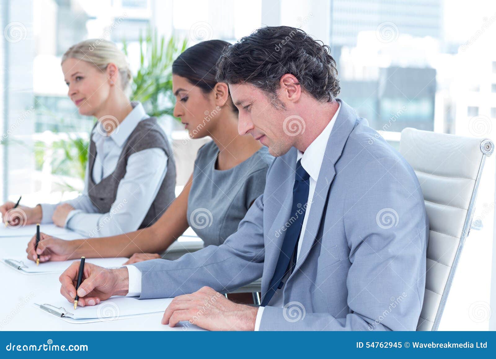 Group of Business People Taking Notes Stock Image - Image of male ...