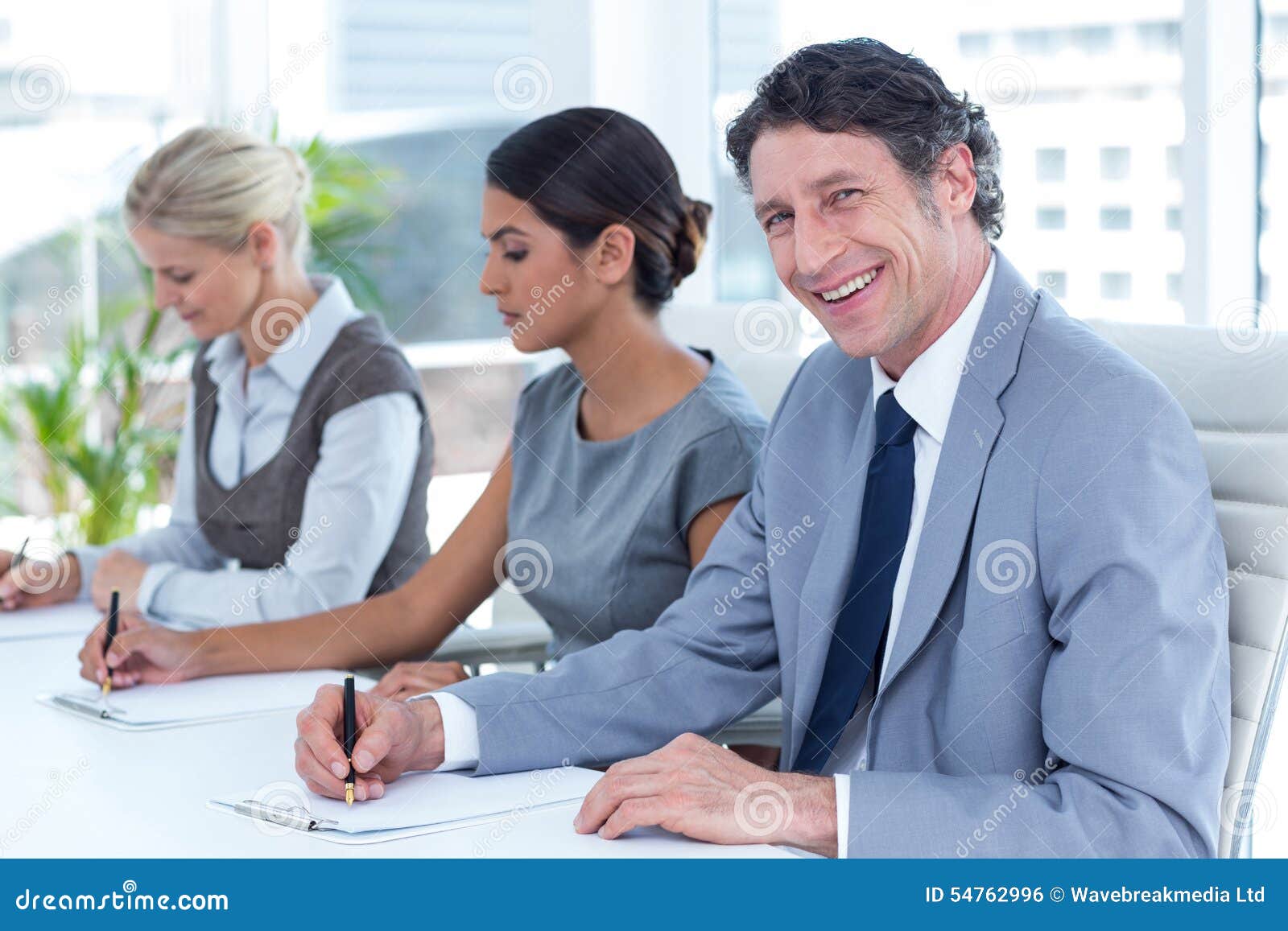 Group of Business People Taking Notes Stock Photo - Image of female ...
