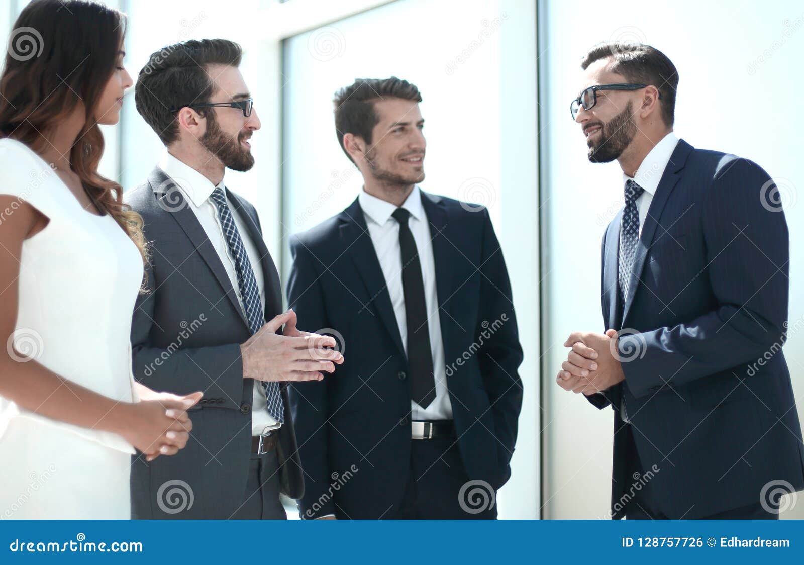 Group of Business People Talking Standing in the Lobby of the of Stock ...