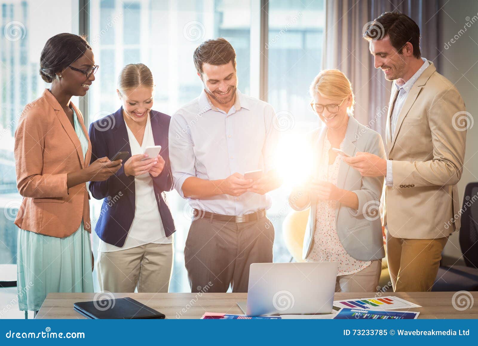 Group of Business People Text Messaging on Mobile Phone Stock Image ...