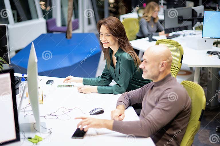 Group of Business People Using Computer and Working Together in a ...