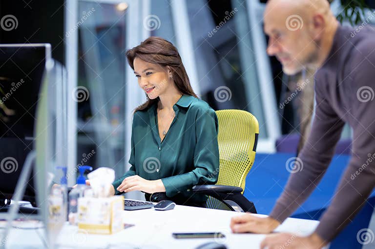 Group of Business People Using Computer and Working Together in a ...