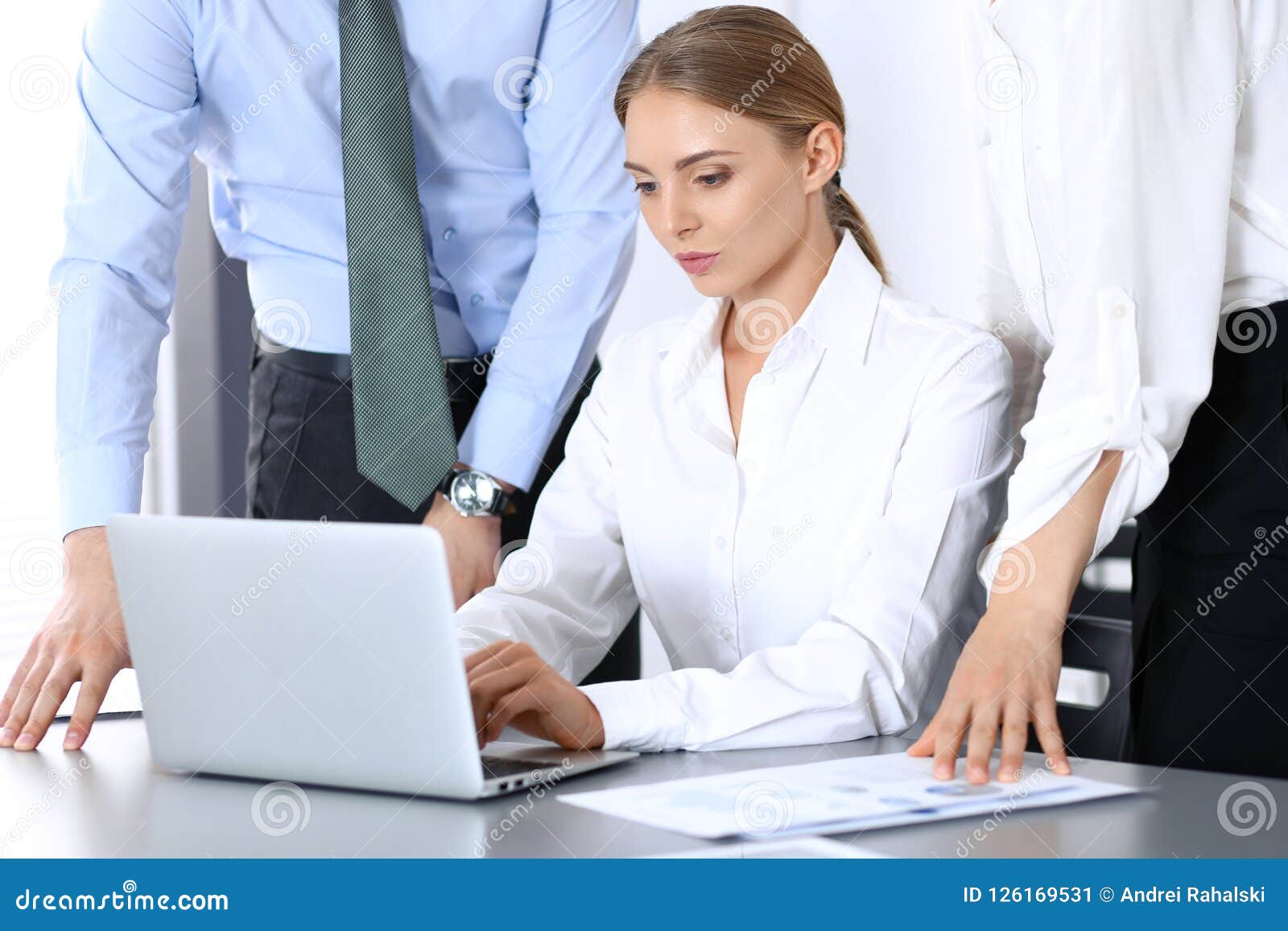 Group of Business People Using Laptop Computer in Office. Meeting and ...