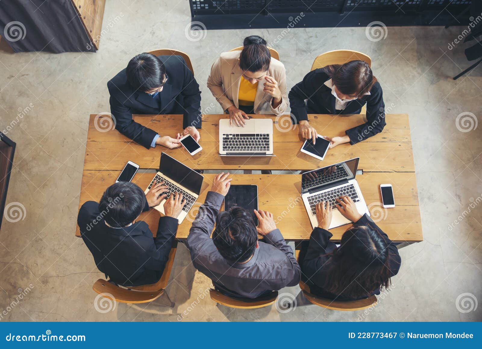Group of Business People Using Laptop, Tablet, and Smartphone Plan ...