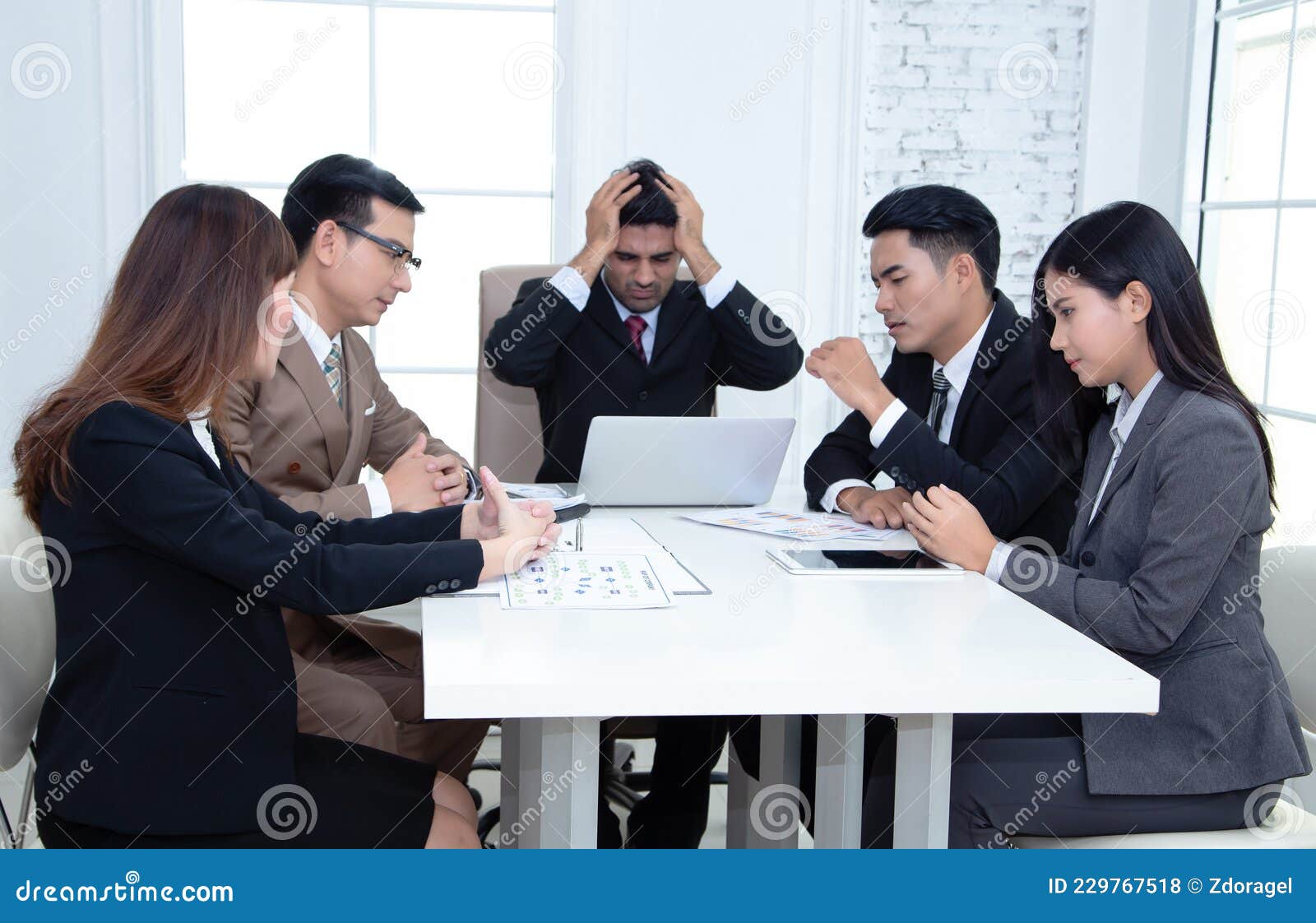 Group of Business Sad and Solving Problem in Office. Unhappy and ...