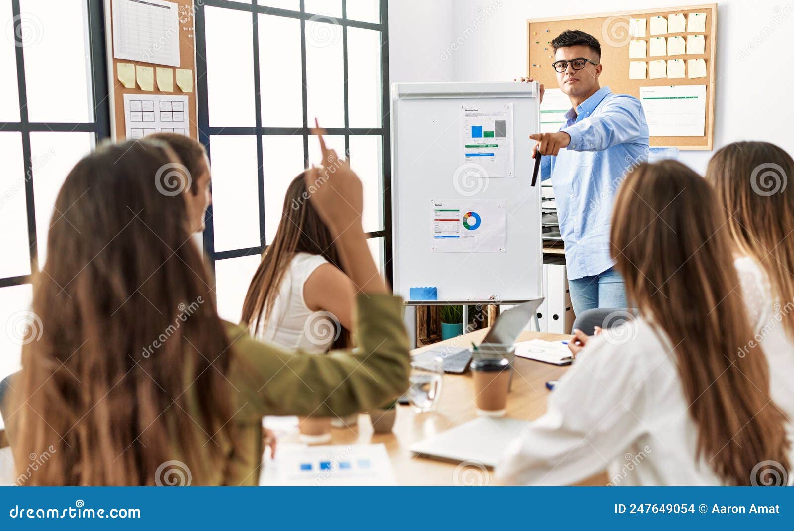 Group of Business Workers on Chart Board Presentation at the Office ...