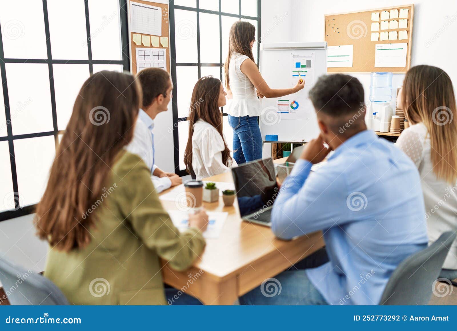 Group of Business Workers on Chart Board Presentation at the Office ...