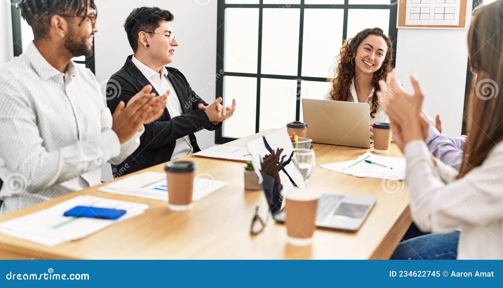 Group of Business Workers Smiling and Clapping To Partner at the Office ...