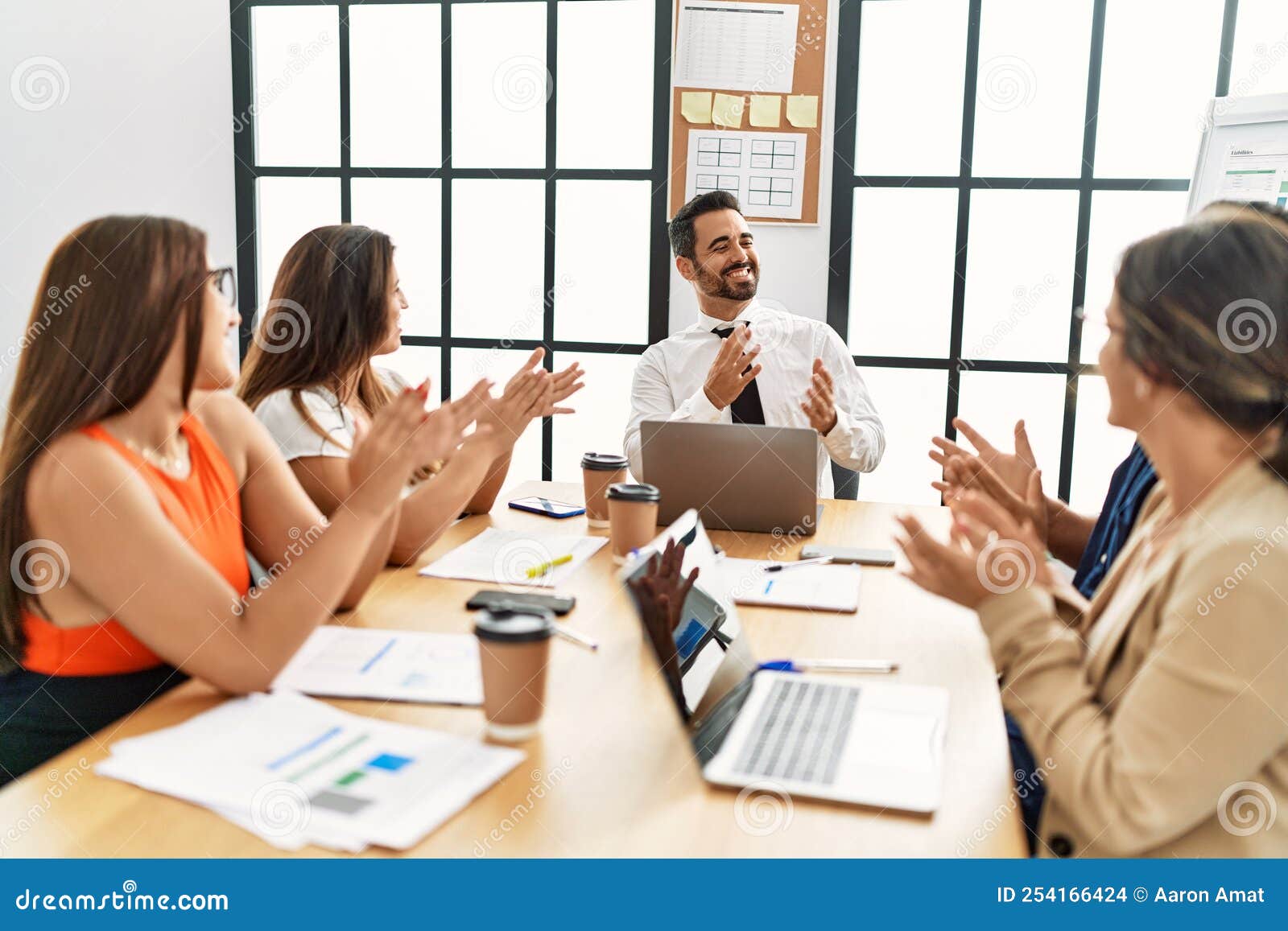 Group of Business Workers Smiling and Clapping To Partner at the Office ...