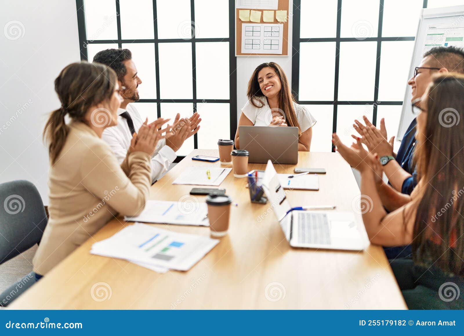 Group of Business Workers Smiling and Clapping To Partner at the Office ...