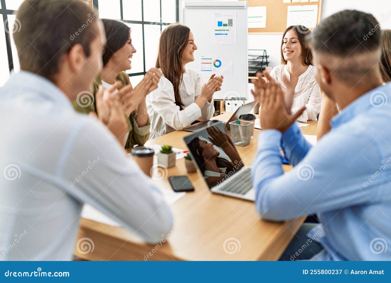 Group of Business Workers Smiling and Clapping To Partner at the Office ...