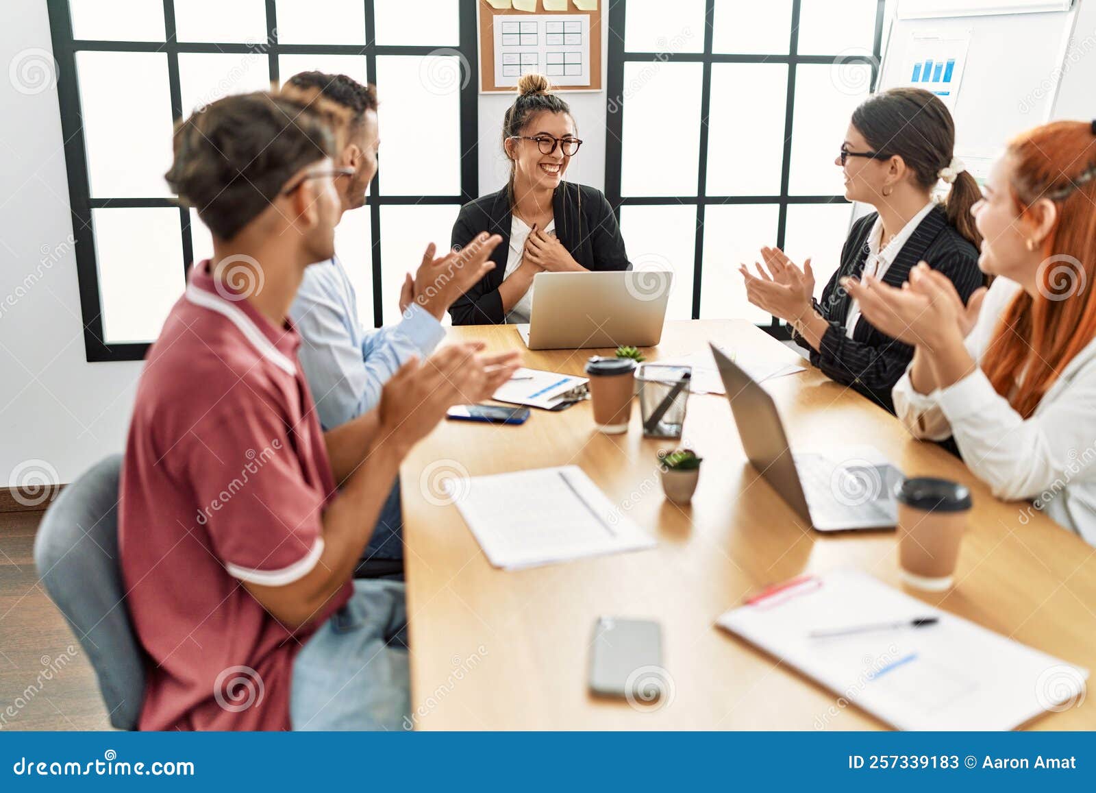 Group of Business Workers Smiling and Clapping To Partner at the Office ...