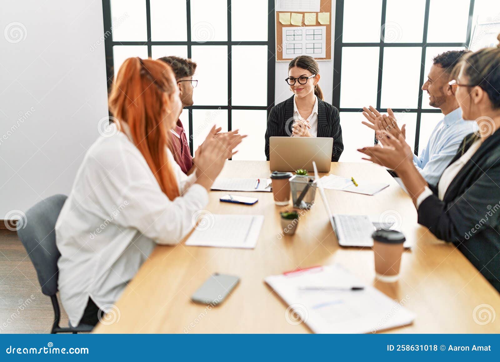 Group of Business Workers Smiling and Clapping To Partner at the Office ...