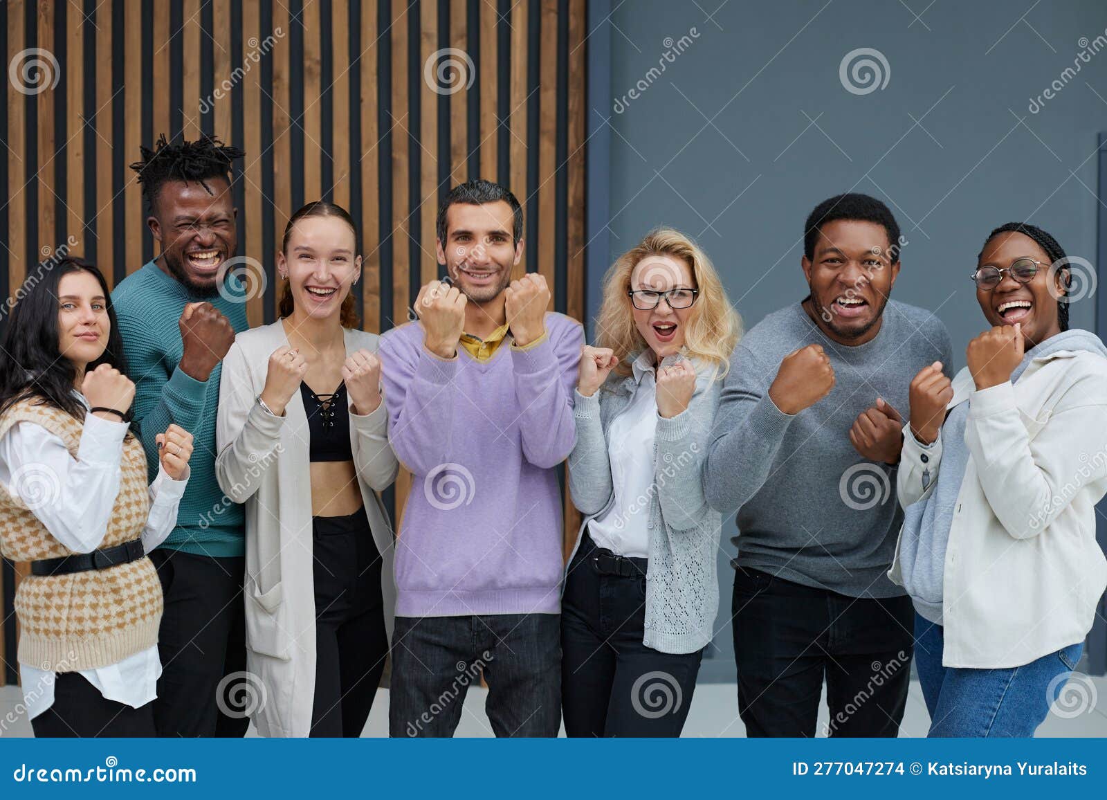 Group of Business Workers Smiling Happy. Standing with Fists Up at the ... Group of Business Workers Smiling Happy. Standing with Fists Up at the ...