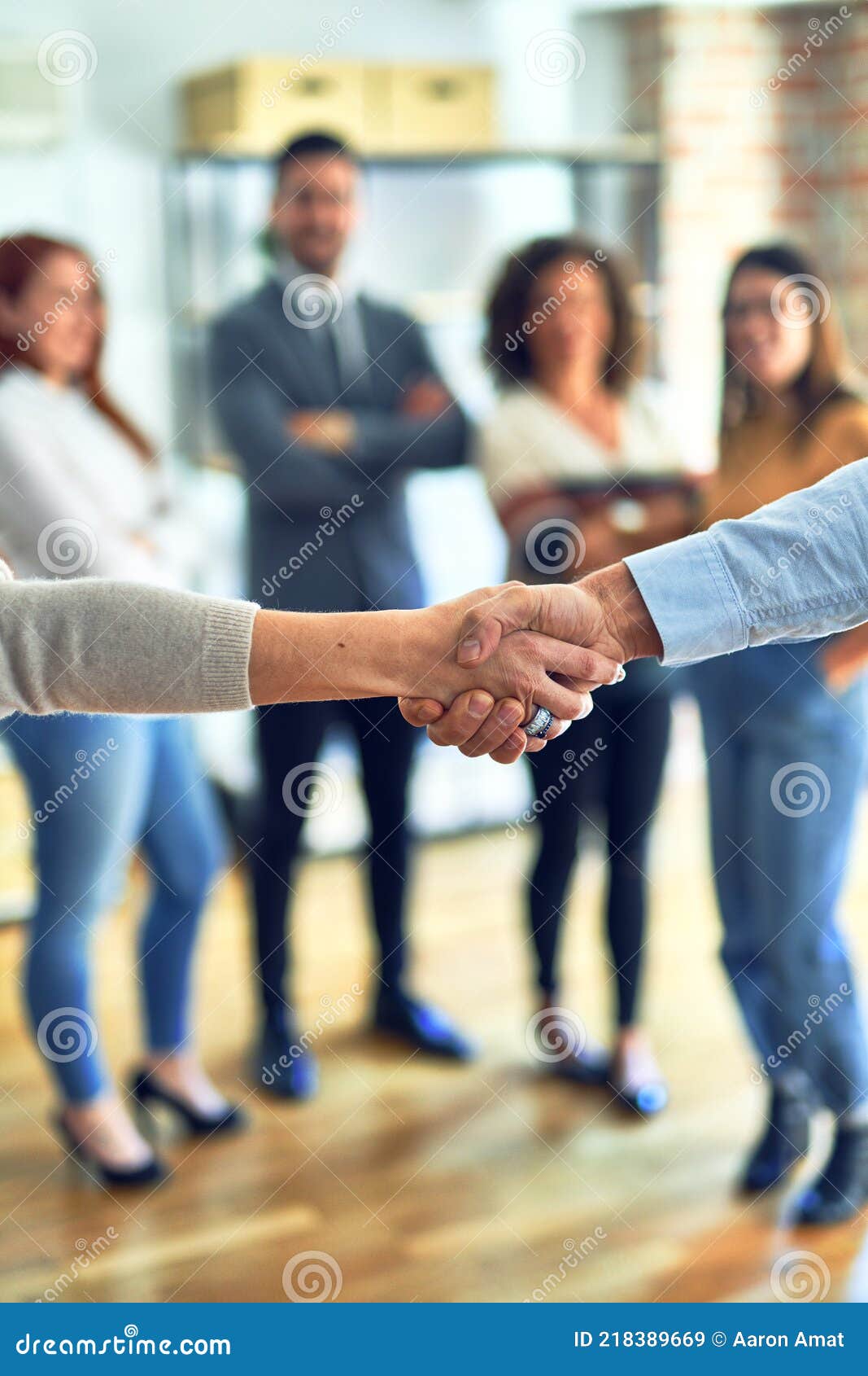 Group of Business Workers Standing Together Shaking Hands at the Office ...