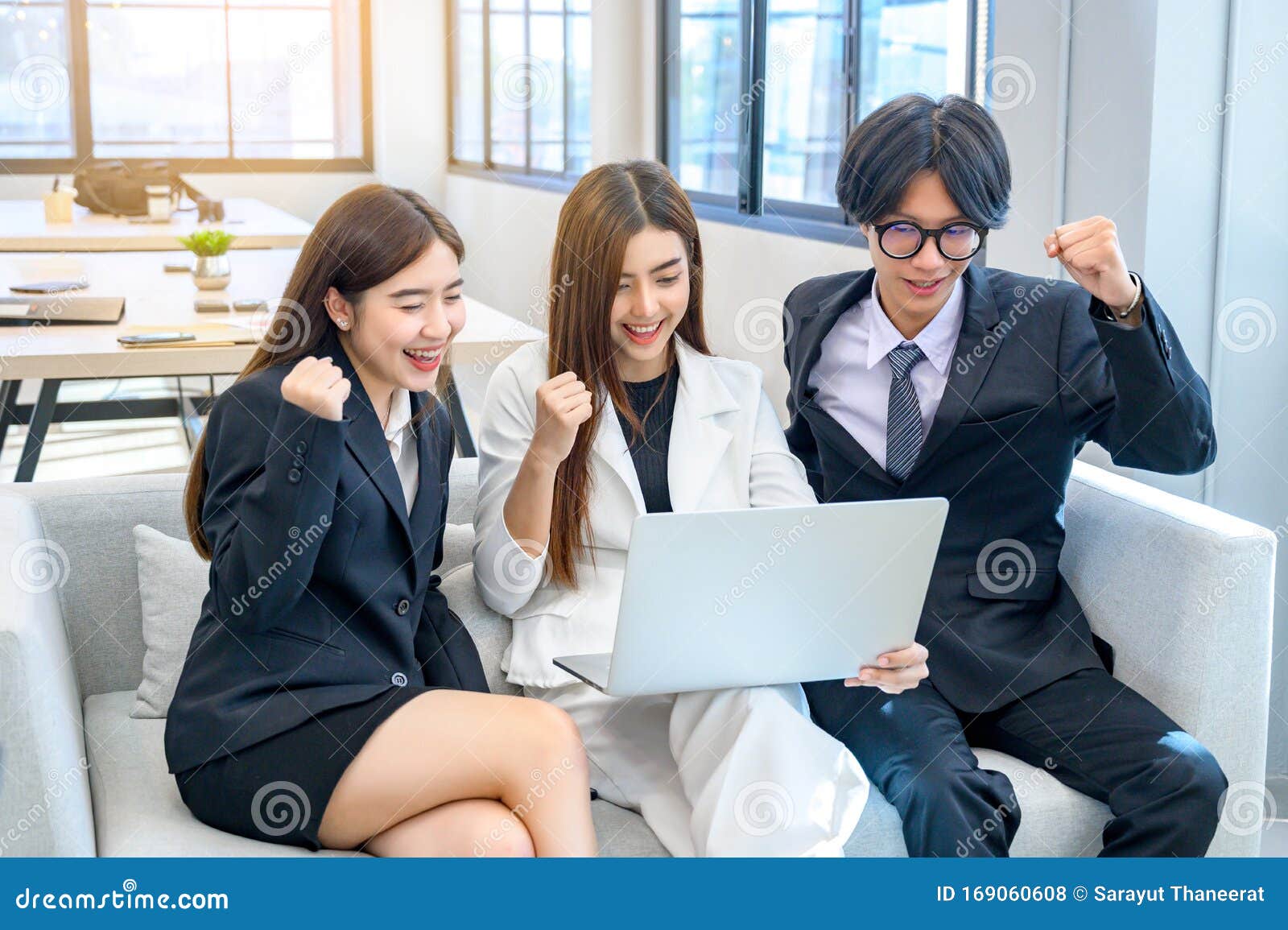 A Group of 3 Businessmen are Happy in Front of the Computer Stock Photo ...