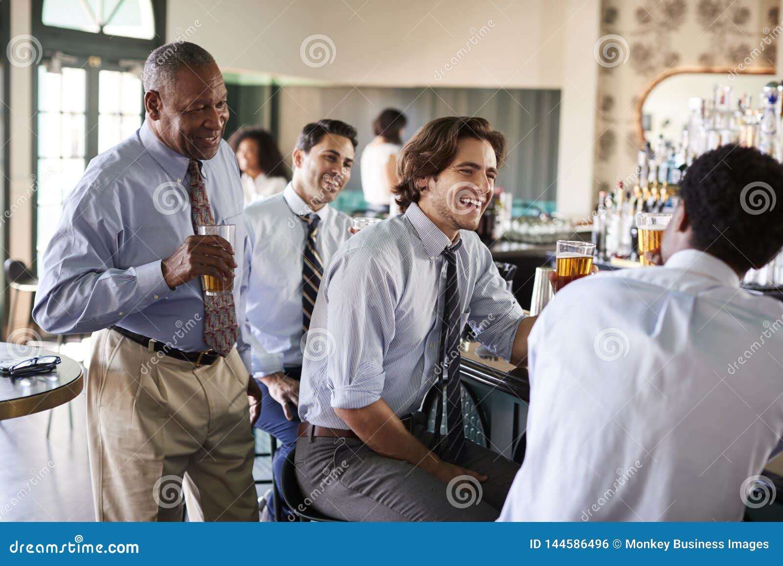 Group of Businessmen Meeting for after Works Drinks in Bar Stock Photo ...
